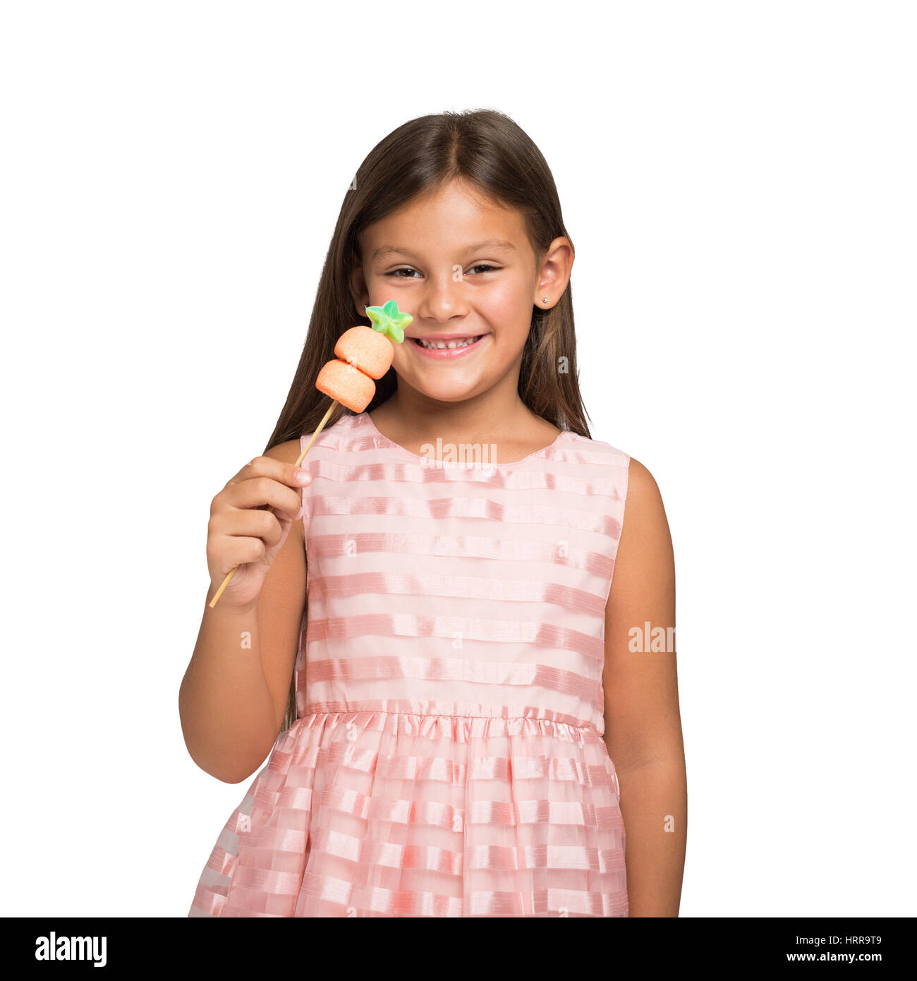 Smiling little child holding a candy. Isolated on white Stock Photo - Alamy