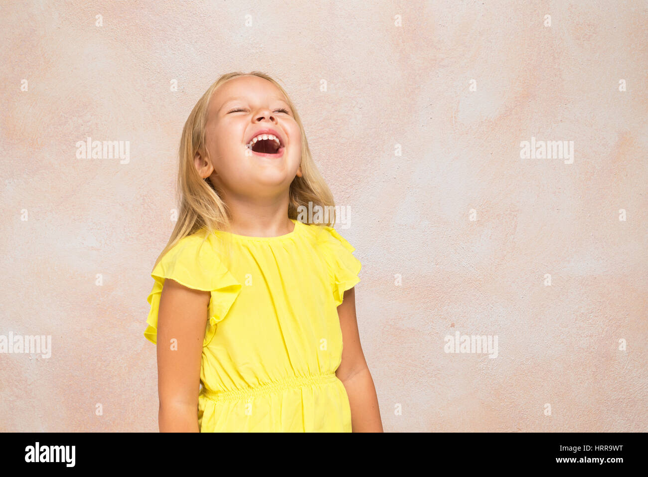 Very happy laughing child. Pink background Stock Photo - Alamy