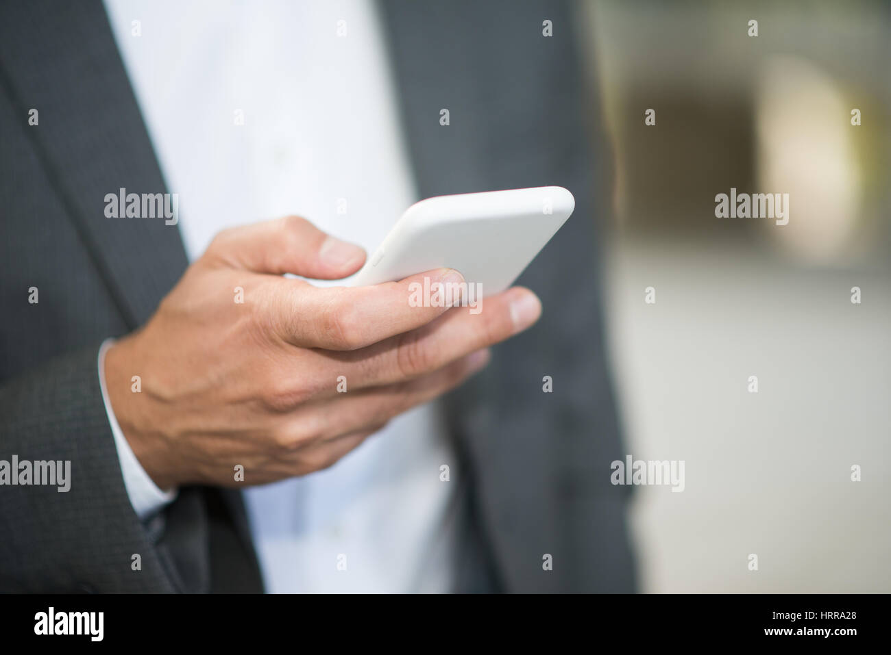Businessman using his mobile phone Stock Photo - Alamy