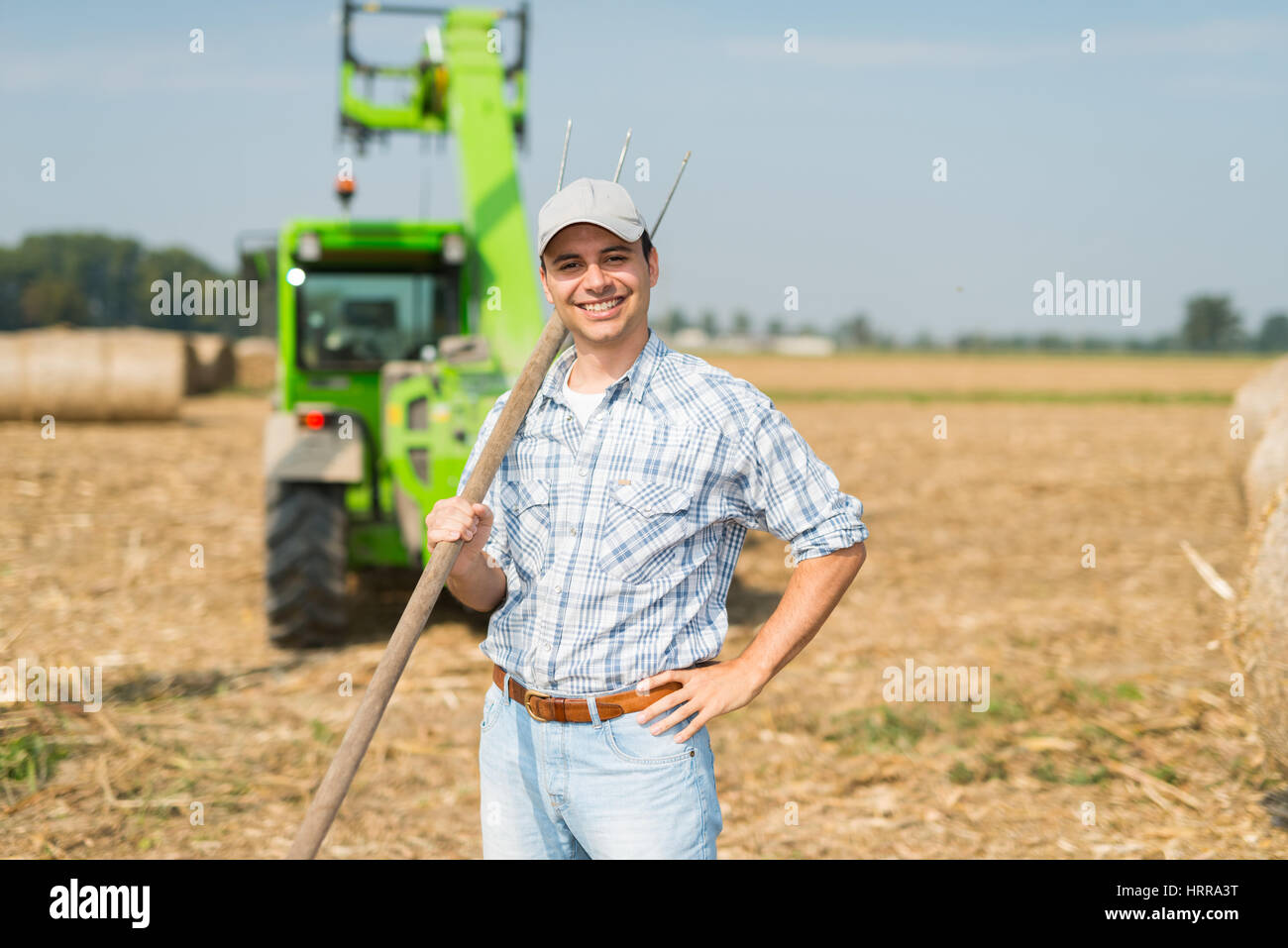 Portrait smiling farmer holding pitchfork hi-res stock photography and ...