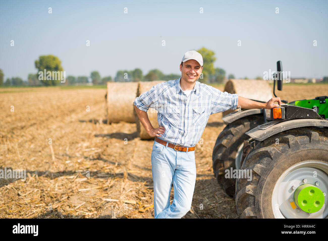 Smiling farmer in his field Stock Photo - Alamy