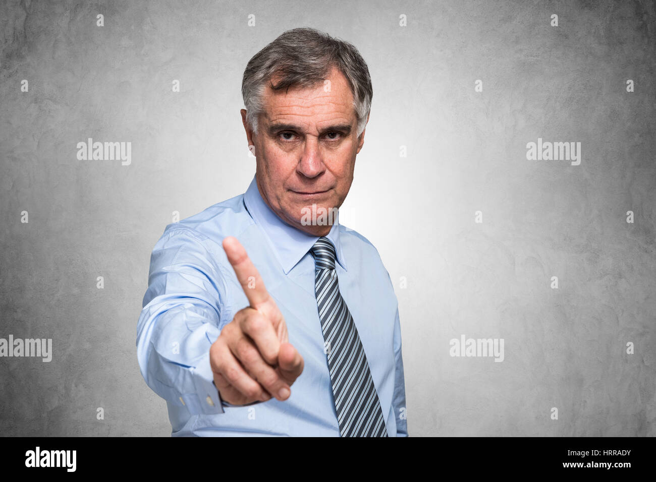 Businessman making the no sign with his finger Stock Photo - Alamy