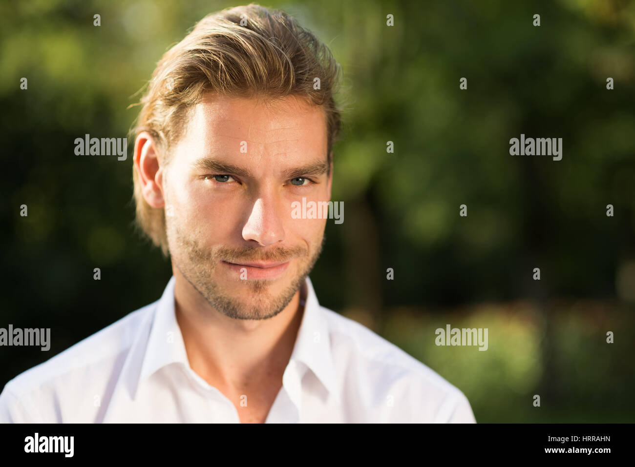 Portrait of a young confident man Stock Photo - Alamy