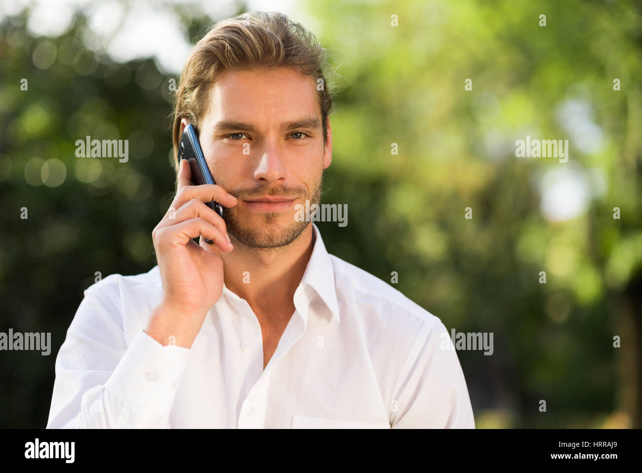 Man talking on the phone Stock Photo - Alamy
