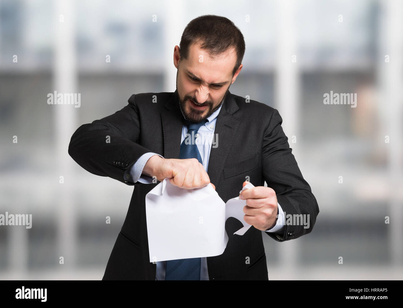 Angry businessman tearing up hi-res stock photography and images - Alamy
