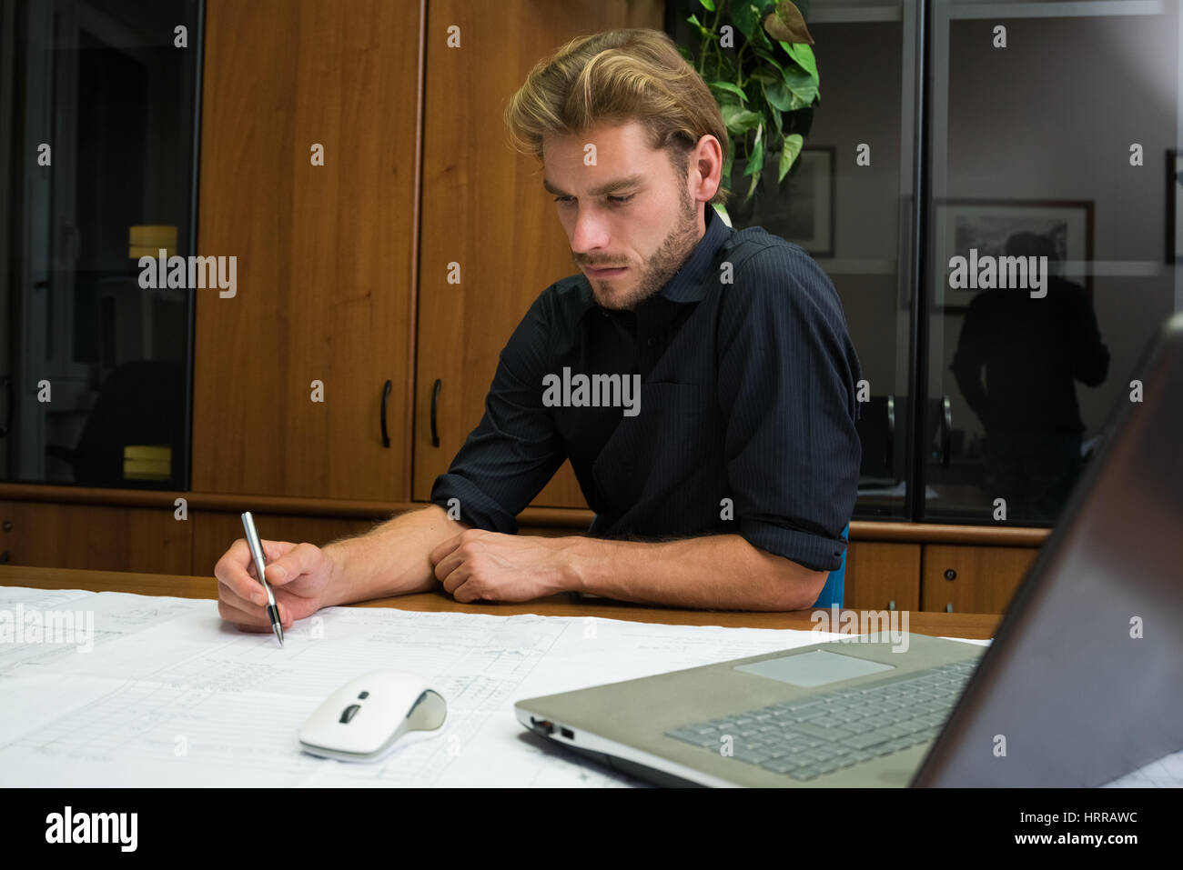 Portrait man construction drawings hi-res stock photography and images ...