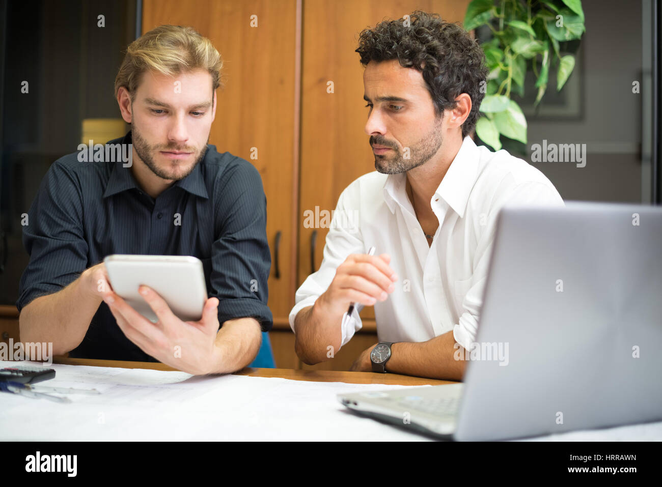 People at work in his office Stock Photo - Alamy