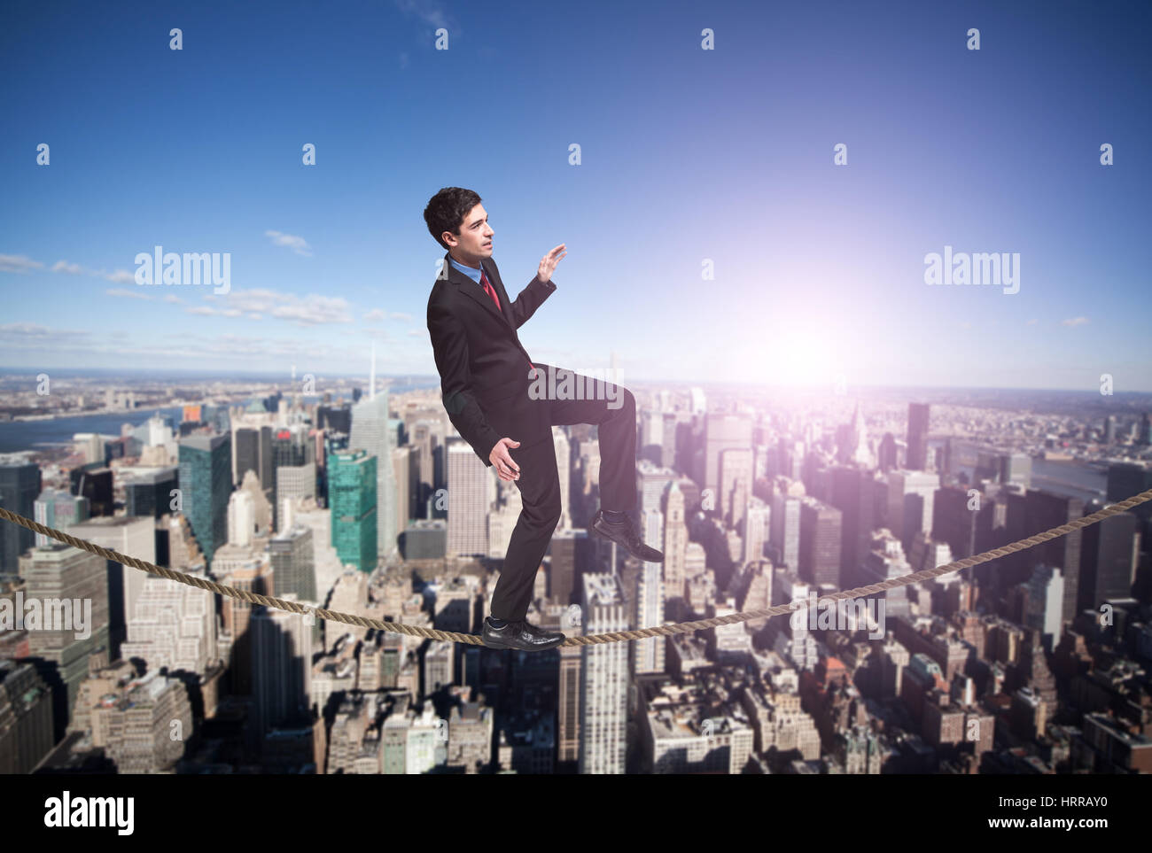 Person trying to balance hi-res stock photography and images - Alamy