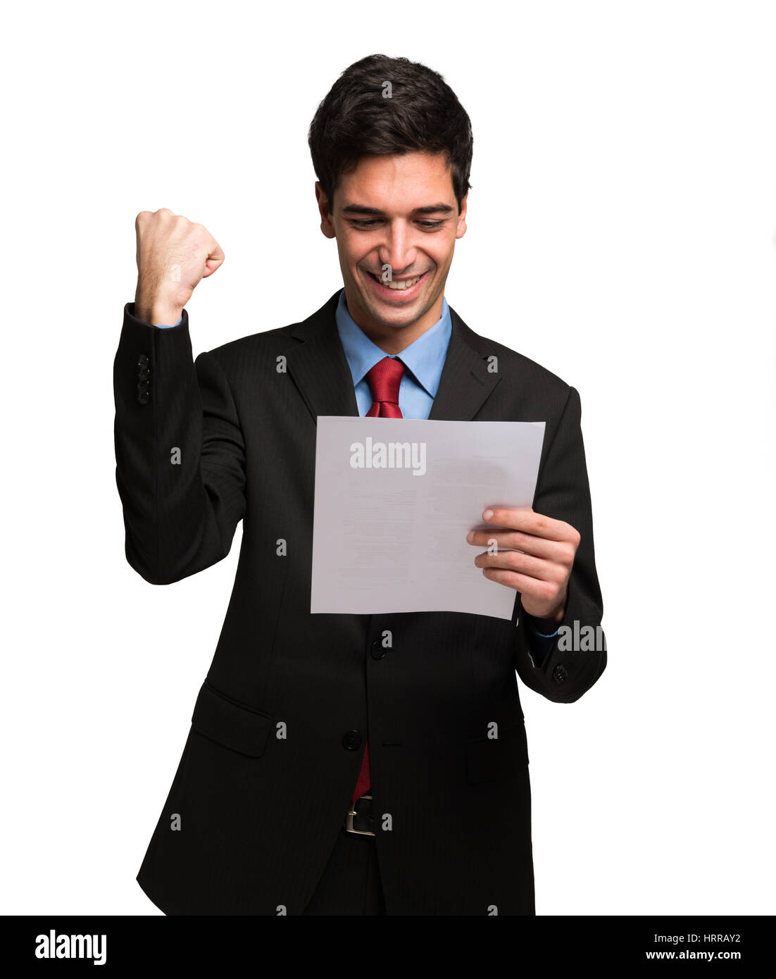 Happy businessman reading a document Stock Photo - Alamy