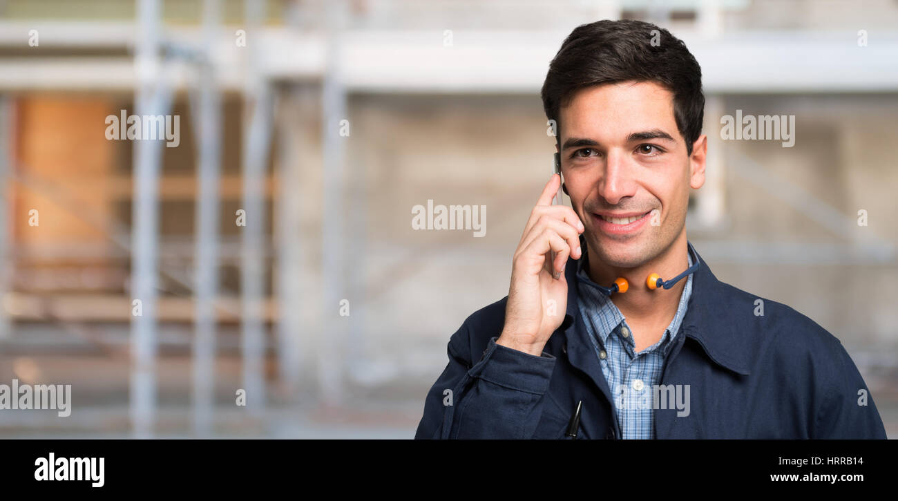 Portrait of an architect talking on the phone Stock Photo - Alamy