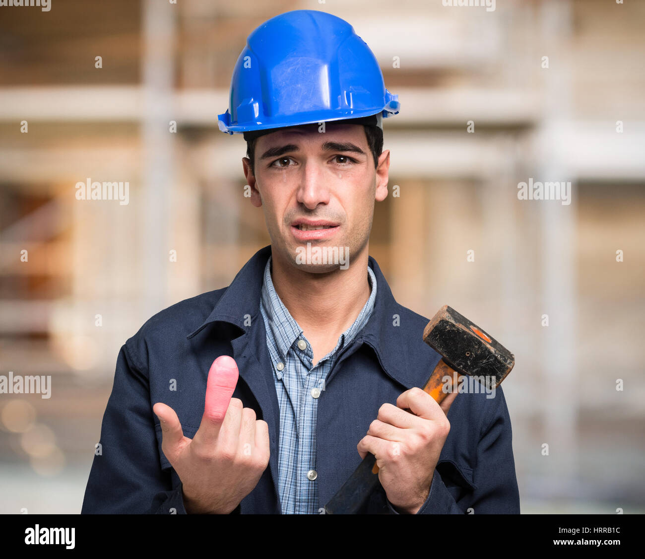 Worker crying for an injured finger Stock Photo - Alamy