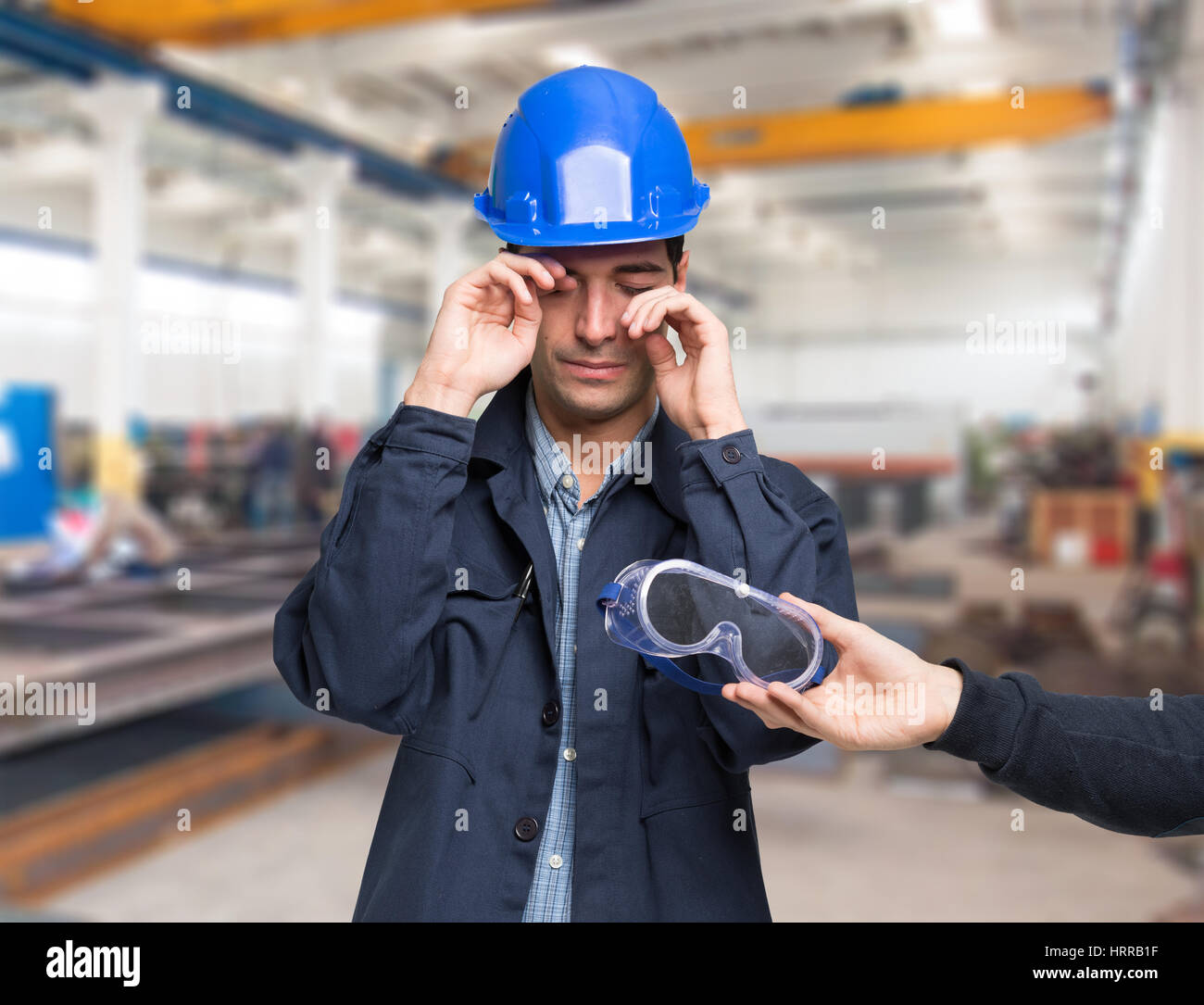 Worker suffering for a splinter in his eye Stock Photo - Alamy