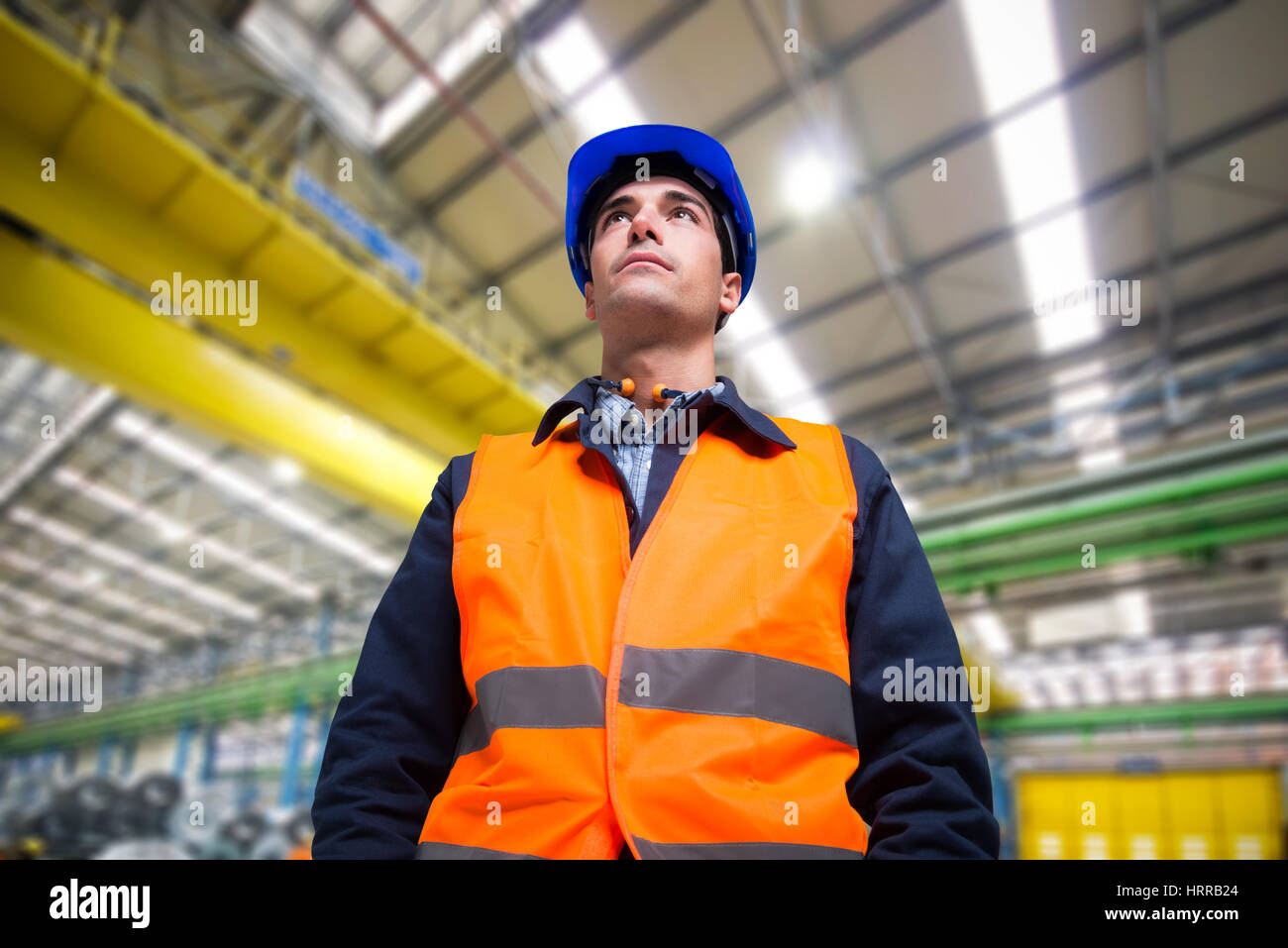 Worker in a industrial site Stock Photo - Alamy