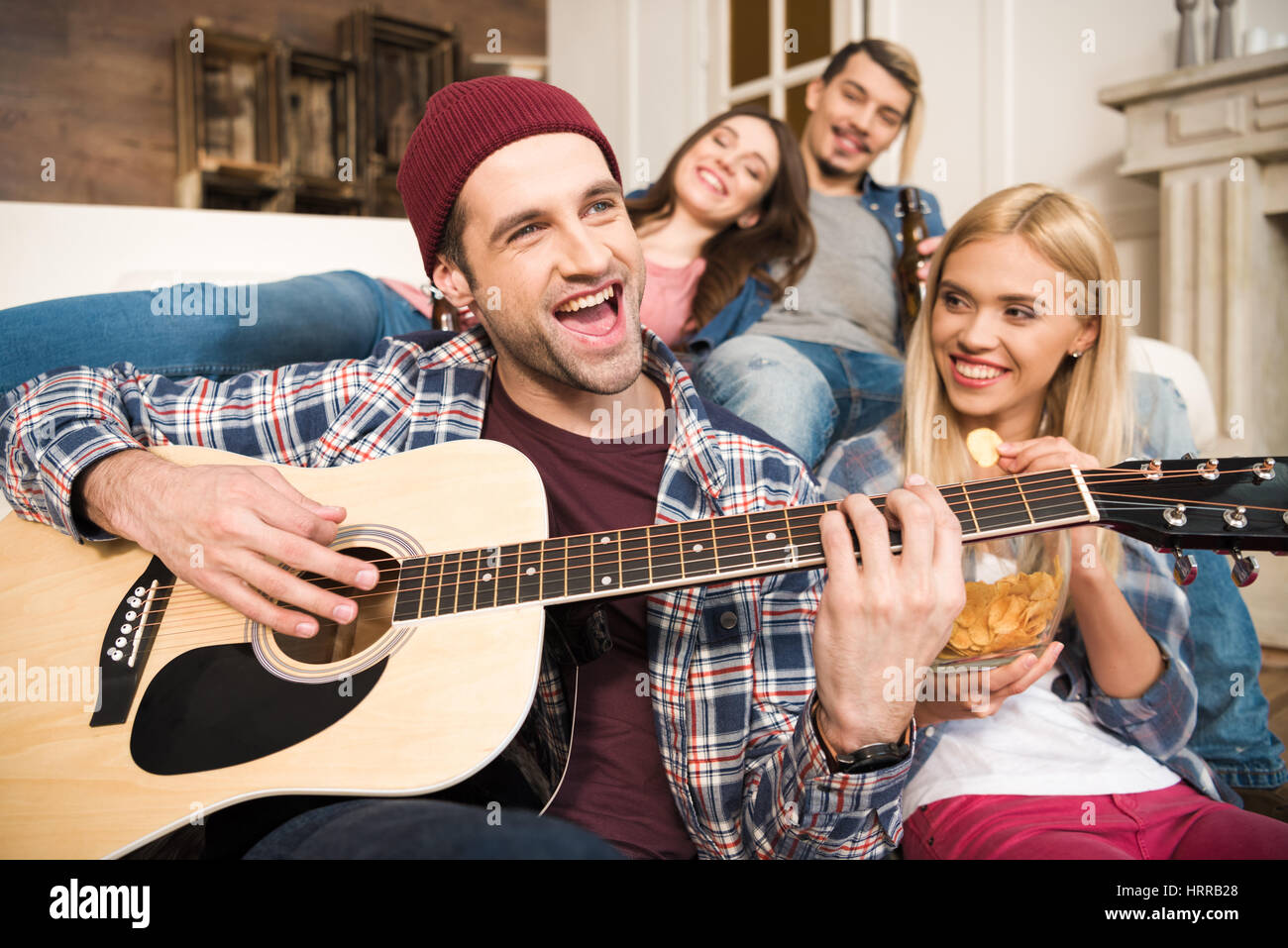Relaxing friends guitar hi-res stock photography and images - Alamy