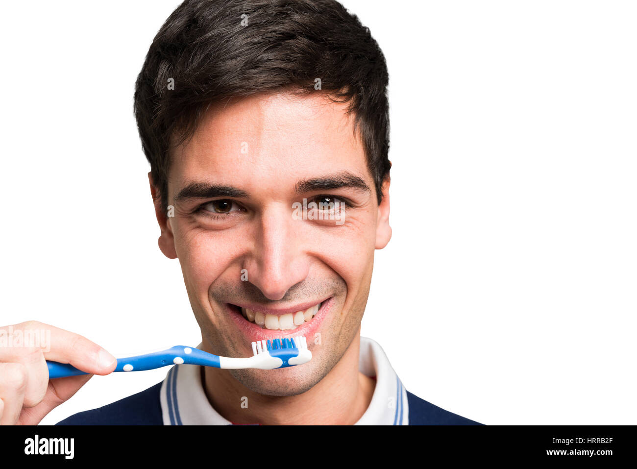 Man cleaning his teeth Stock Photo - Alamy