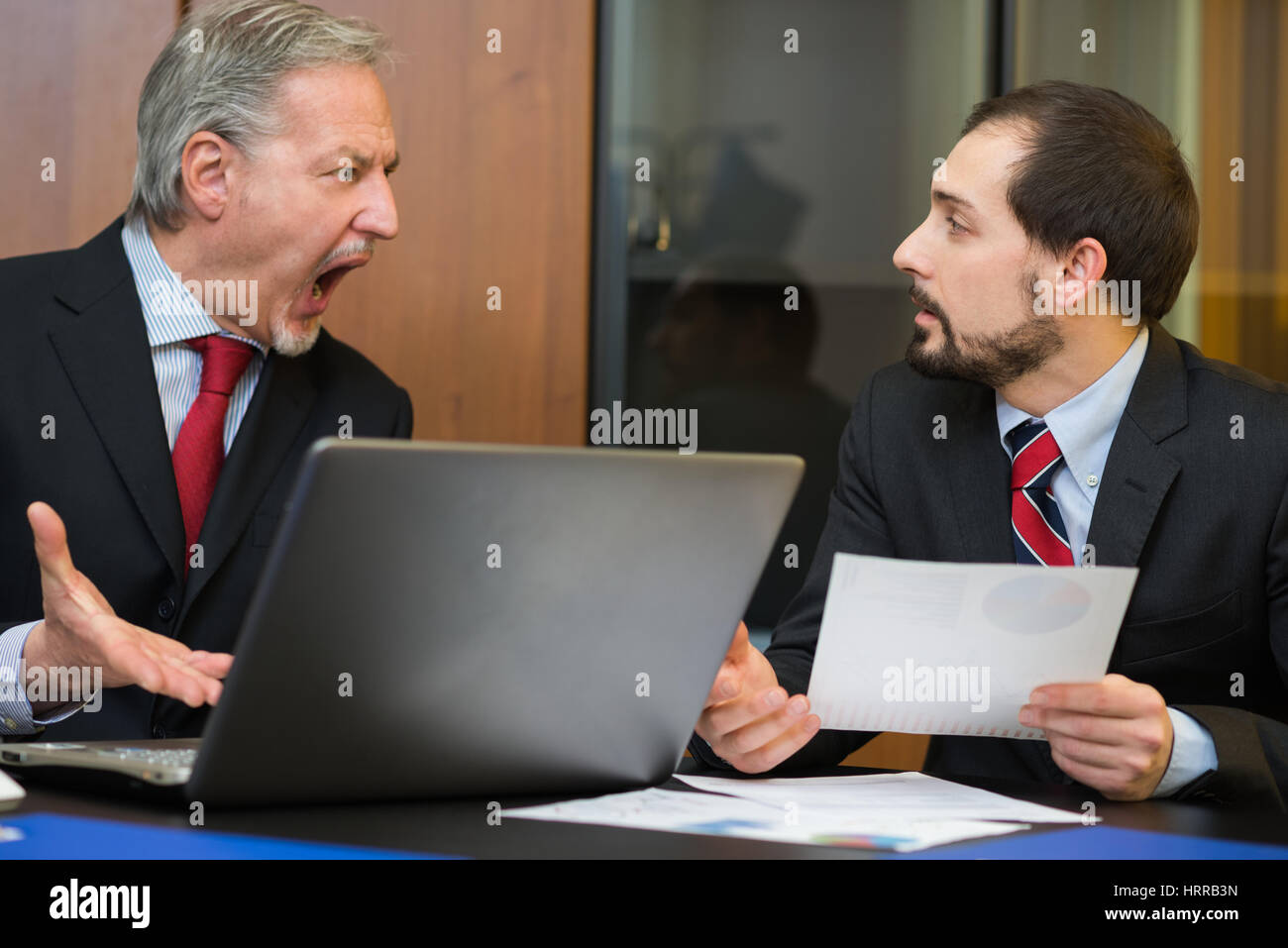 Angry businessman shouting to a colleague Stock Photo - Alamy