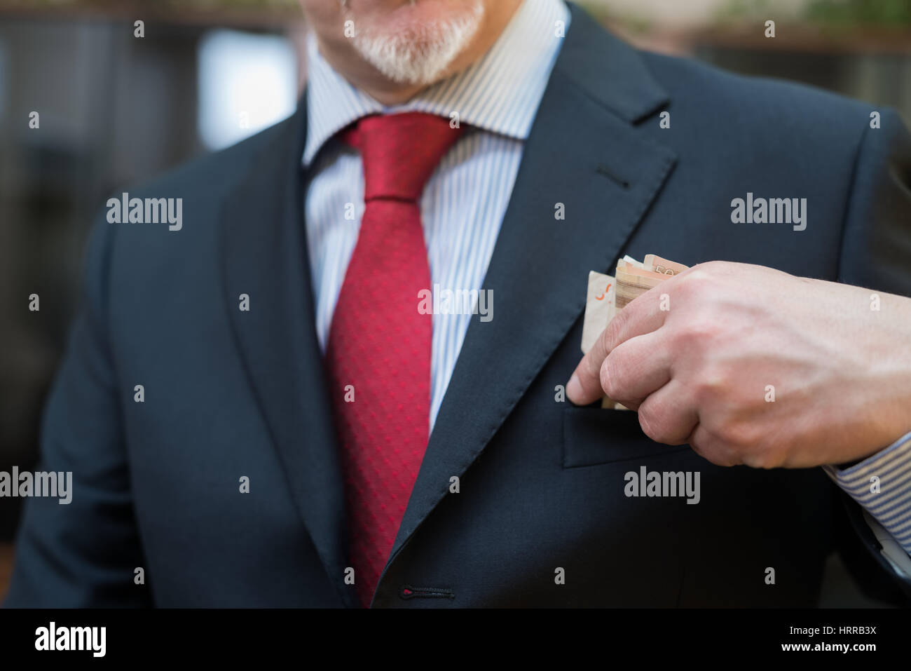 Man taking a bribe Stock Photo - Alamy