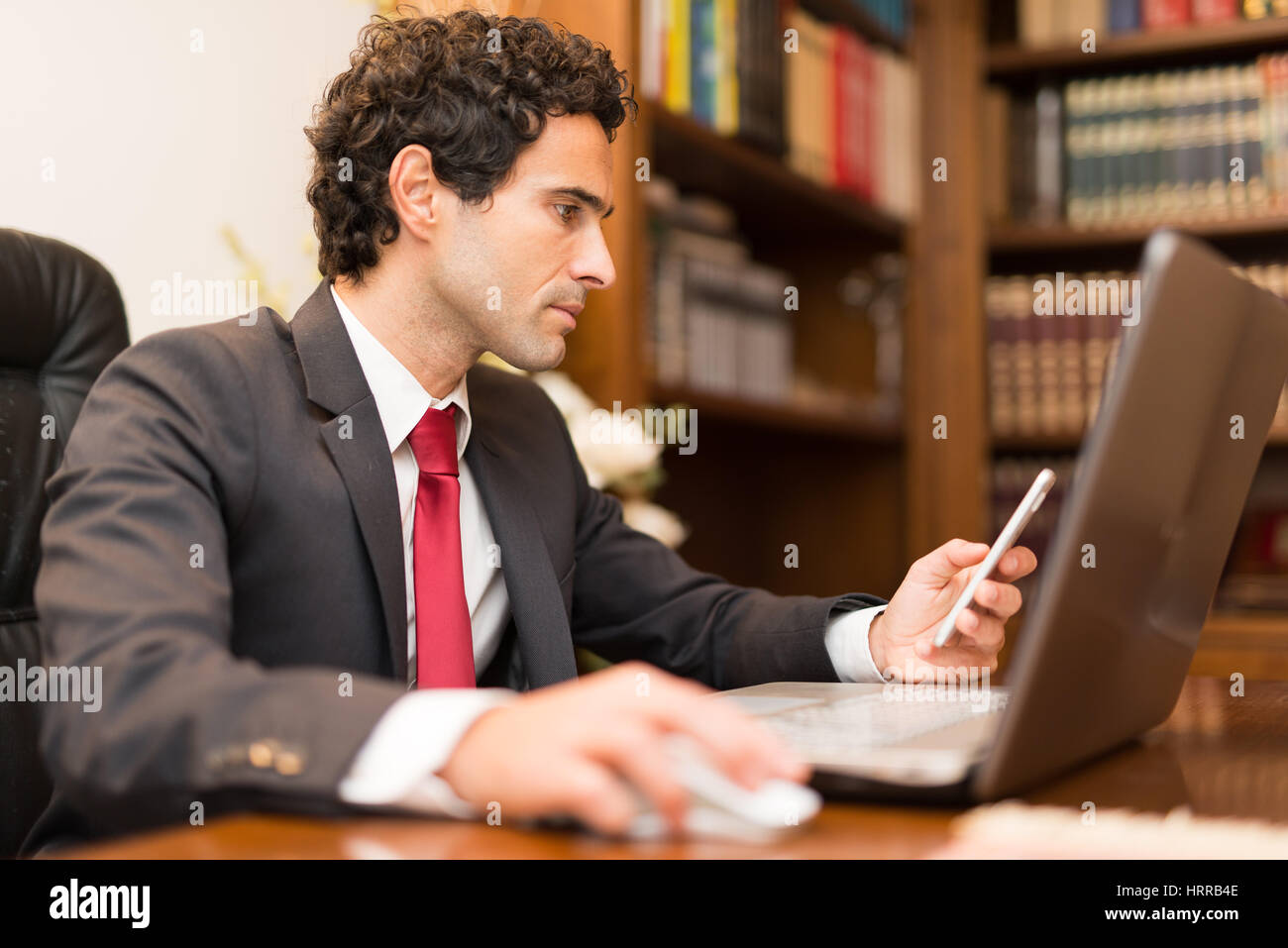Businessman at work in his office Stock Photo - Alamy