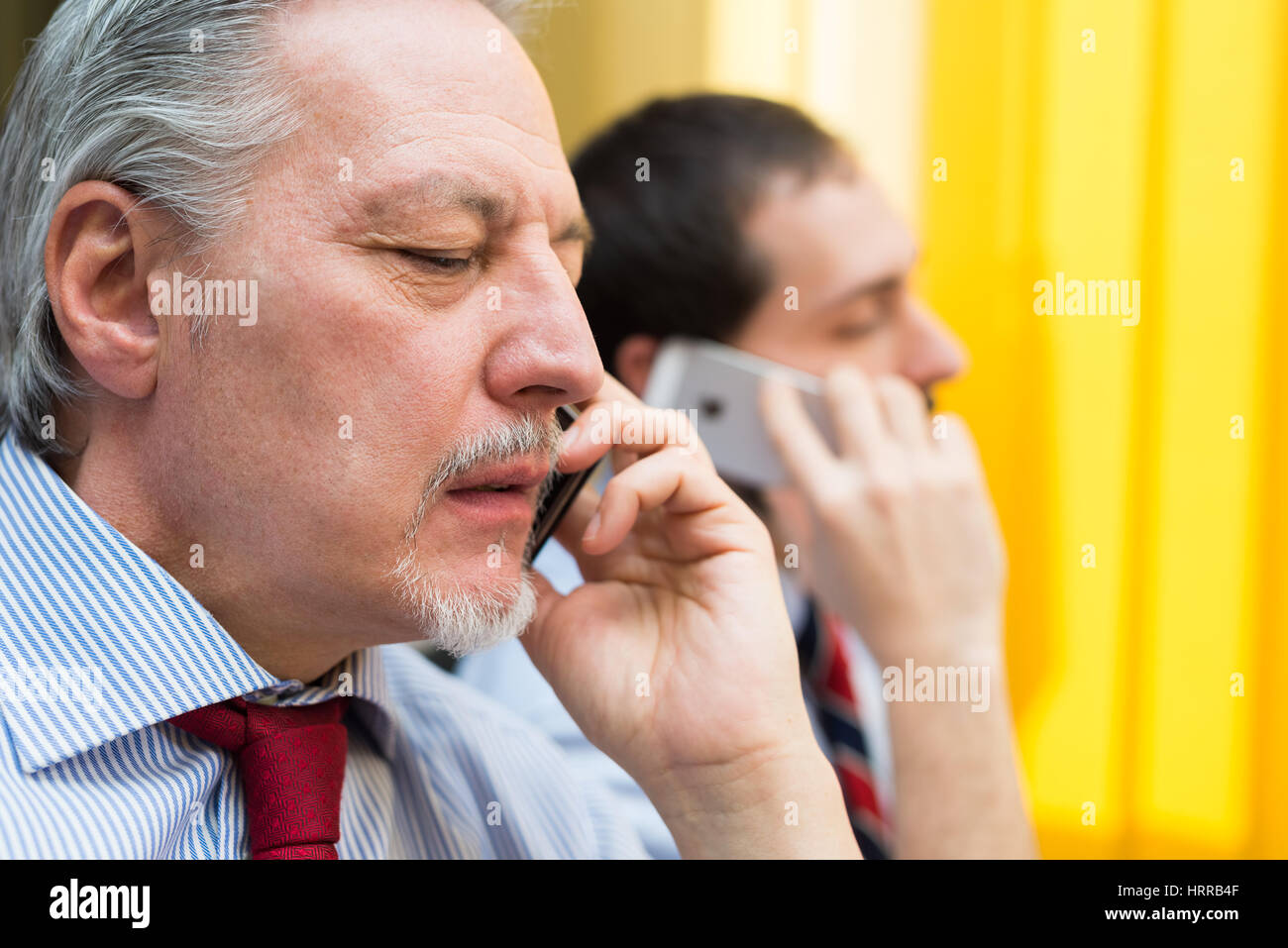 Business people talking on the phone Stock Photo - Alamy