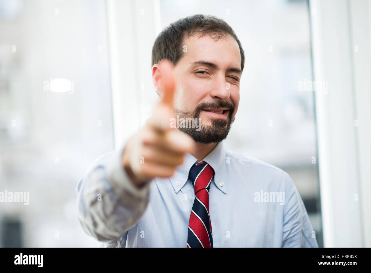 Smiling confident businessman pointing his finger at you Stock Photo ...