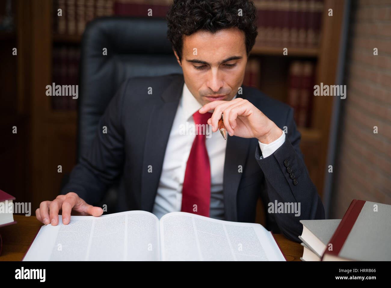 Businessman reading books desk hi-res stock photography and images - Alamy