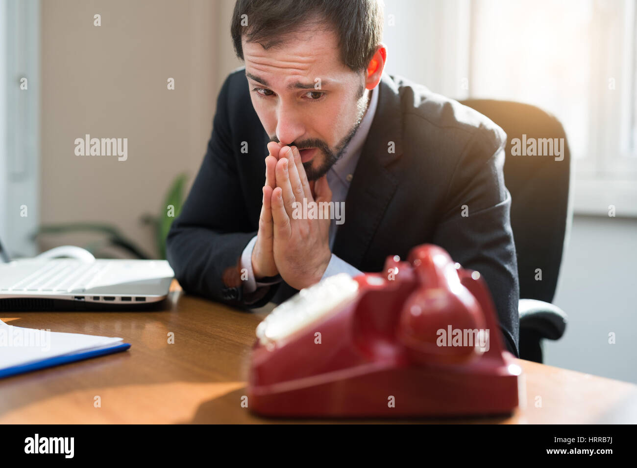 Waiting for a phone call Stock Photo - Alamy
