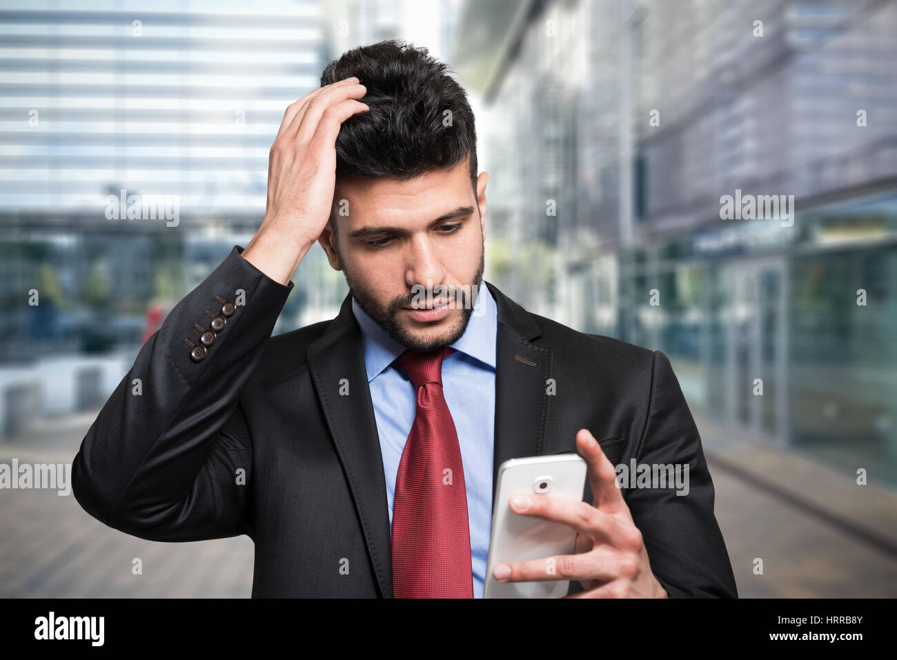 Man looking at his mobile hi-res stock photography and images - Alamy