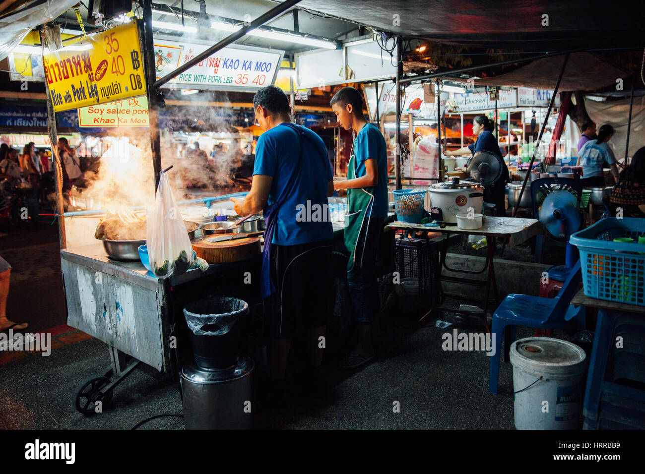 Chiang Mai, Thailand - August 27, 2016: Father and sun cooking food at ...