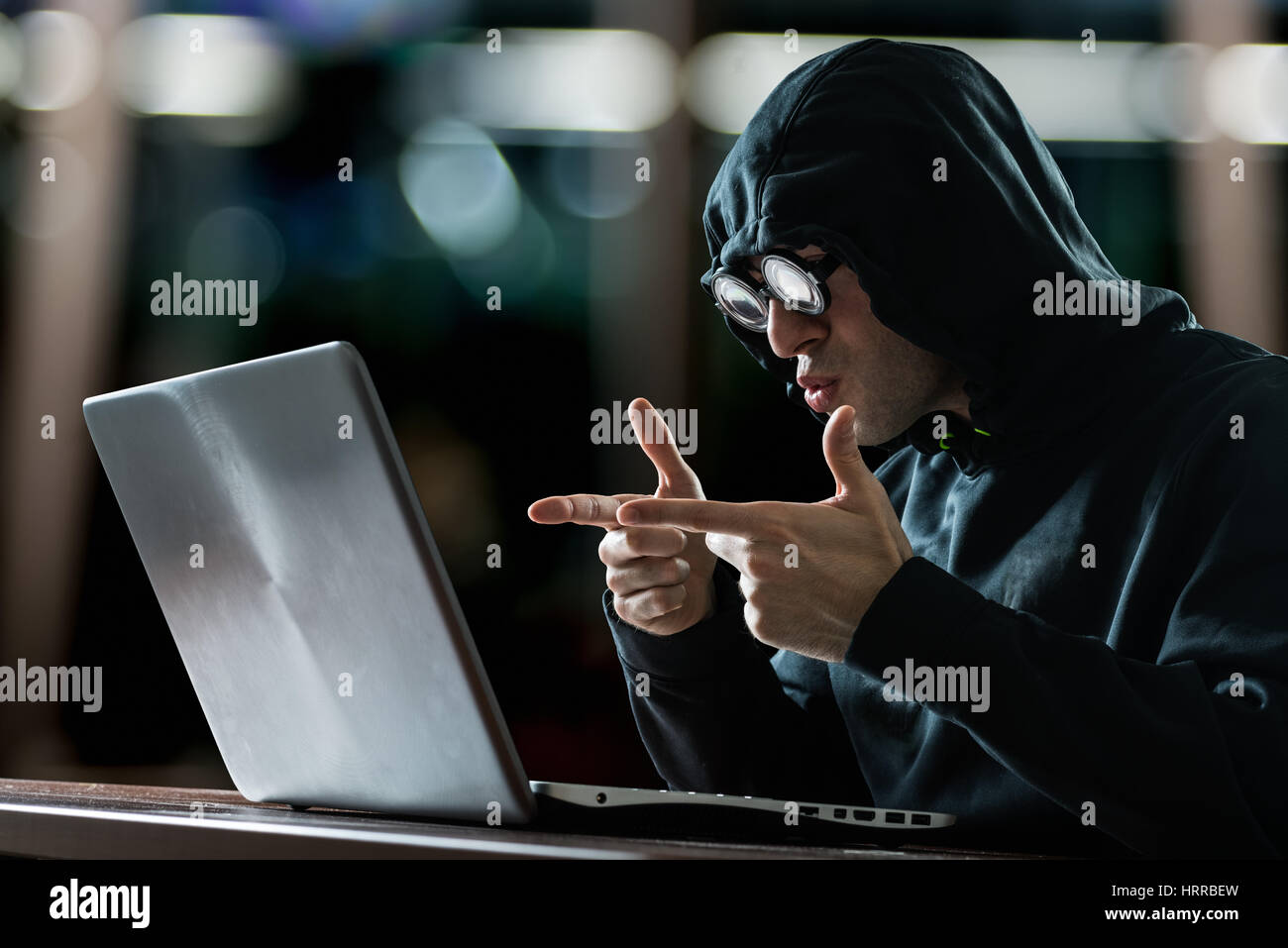 Hacker in front of his computer Stock Photo - Alamy
