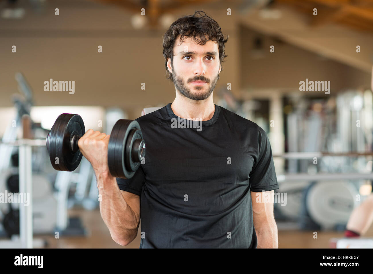 Man working out in a gym Stock Photo - Alamy