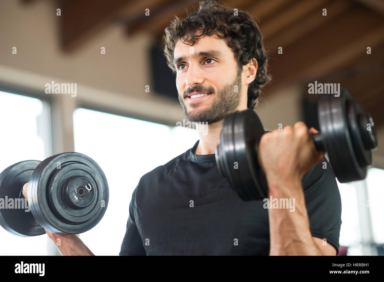 Man working out in a gym Stock Photo - Alamy