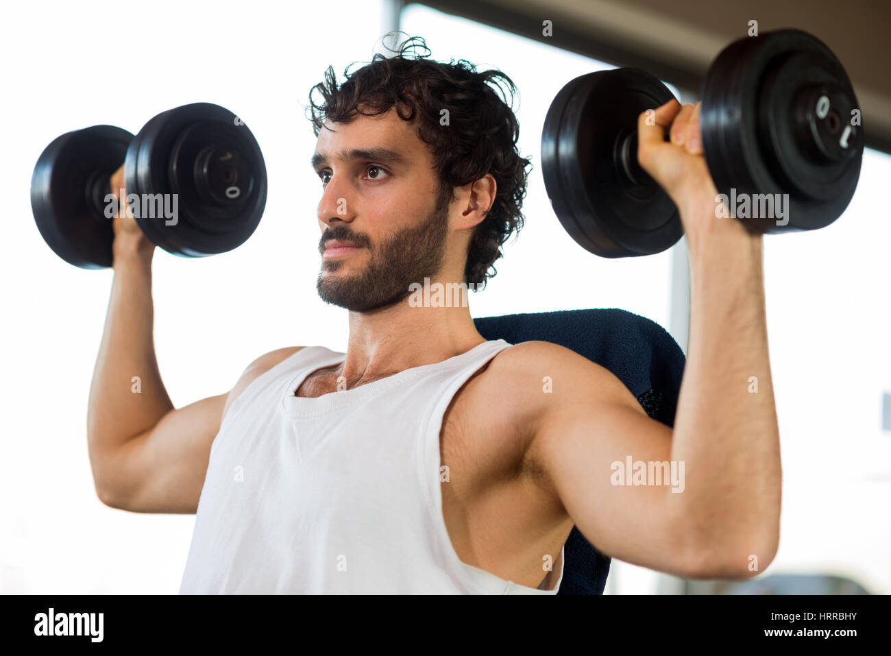 Man working out in a gym Stock Photo - Alamy