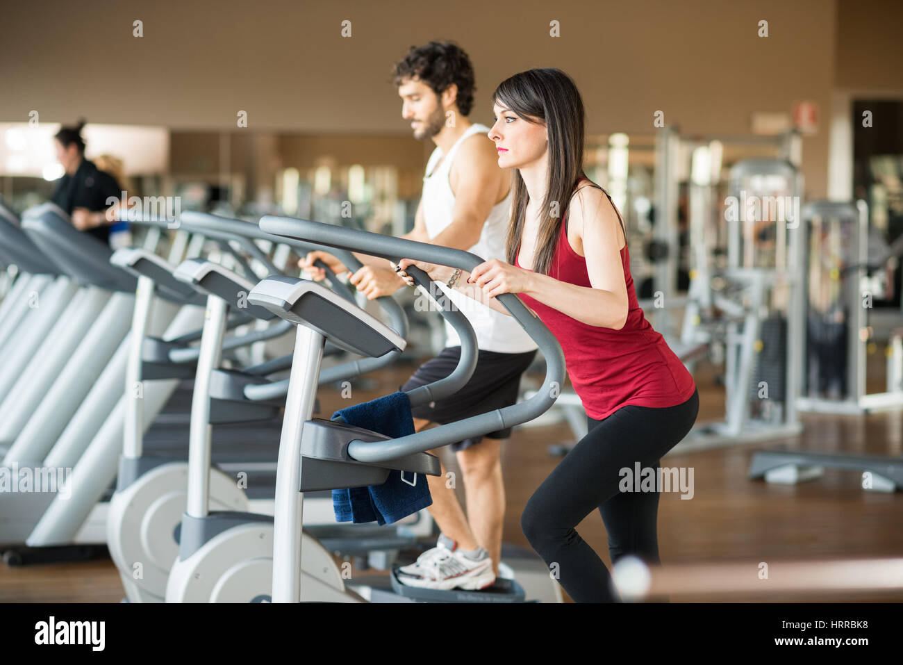 People working out in a fitness center Stock Photo - Alamy
