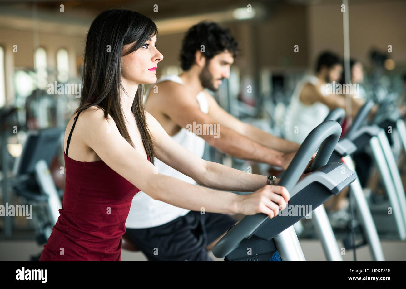 Fit people working out in a gym Stock Photo - Alamy