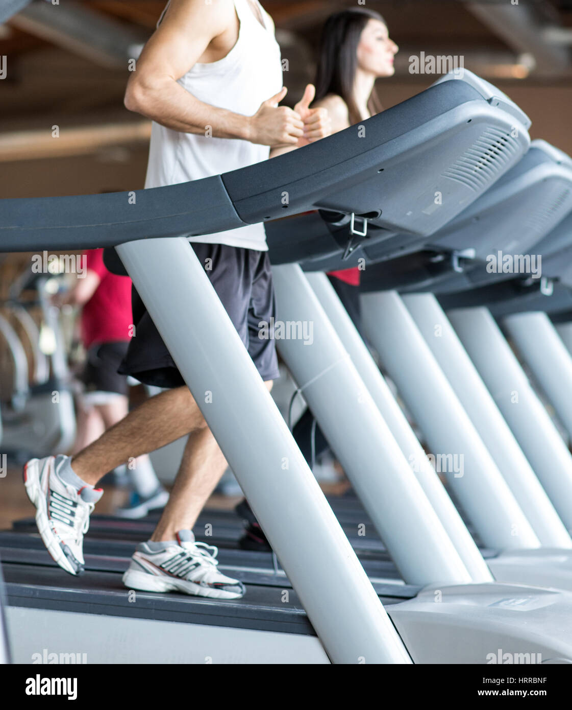Gropu of people running on treadmills Stock Photo - Alamy