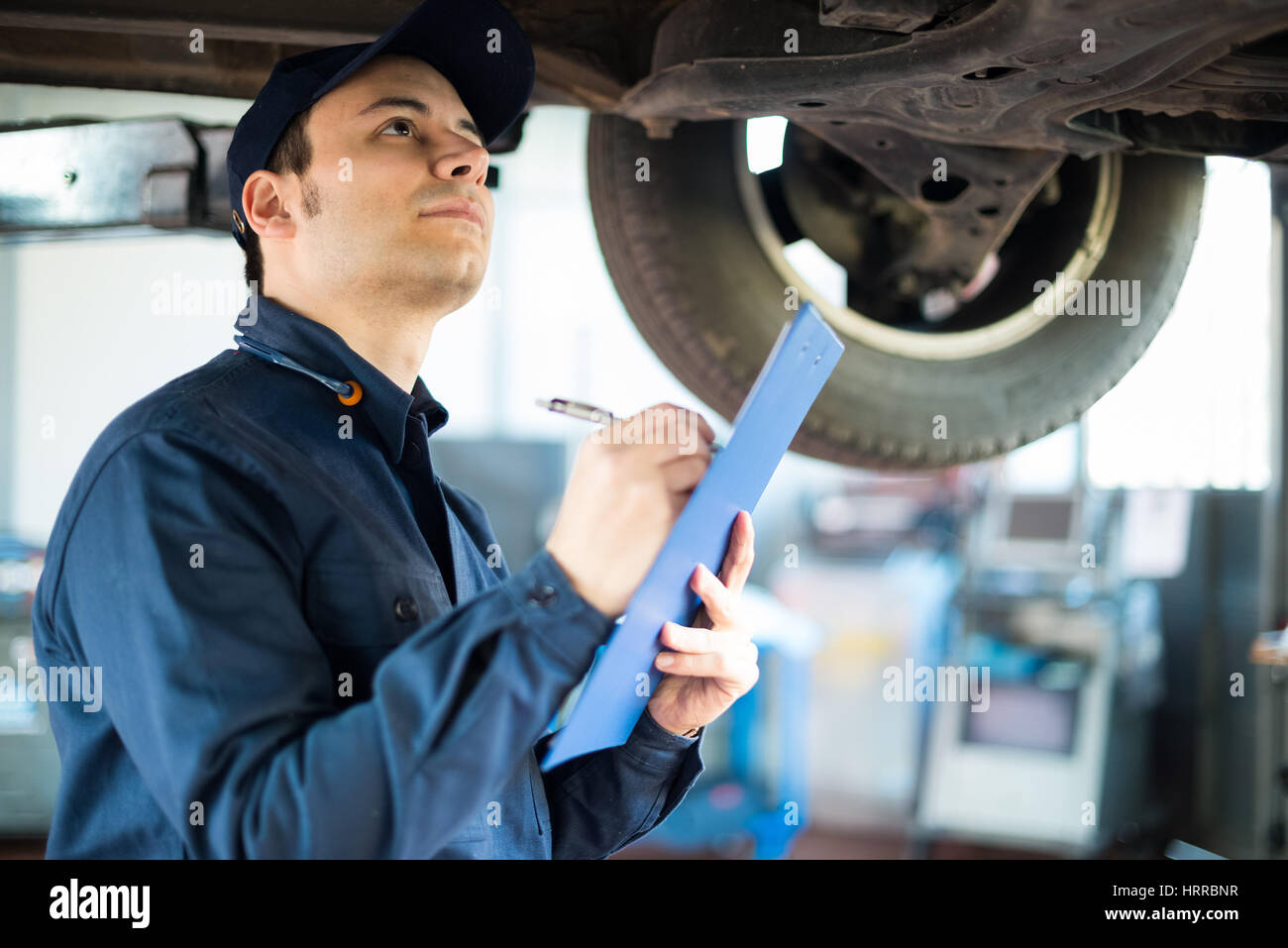 Portrait mechanic taking notes hi-res stock photography and images - Alamy