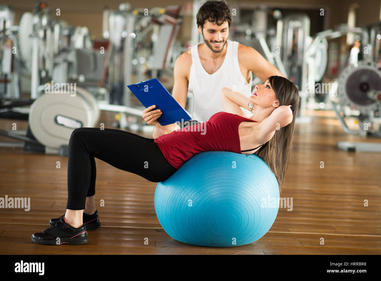 Fit woman using exercise ball hi-res stock photography and images - Alamy