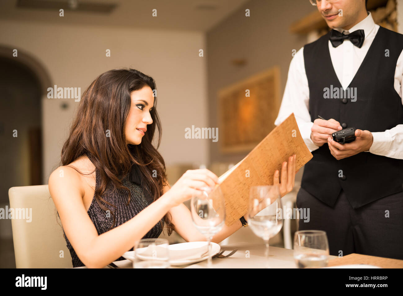 Couple ordering dinner in a luxury restaurant Stock Photo - Alamy