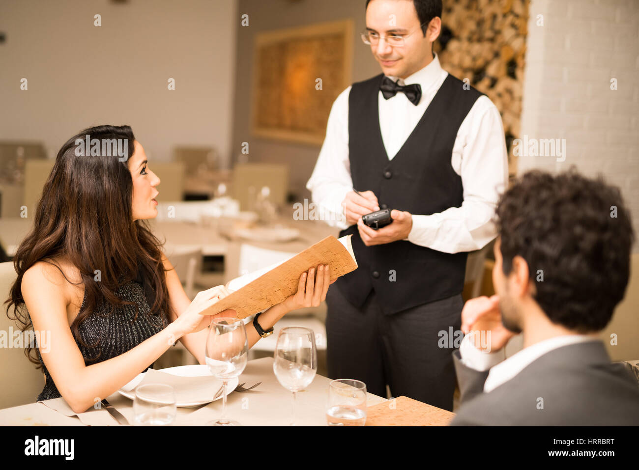 Couple ordering food in restaurant hi-res stock photography and images ...