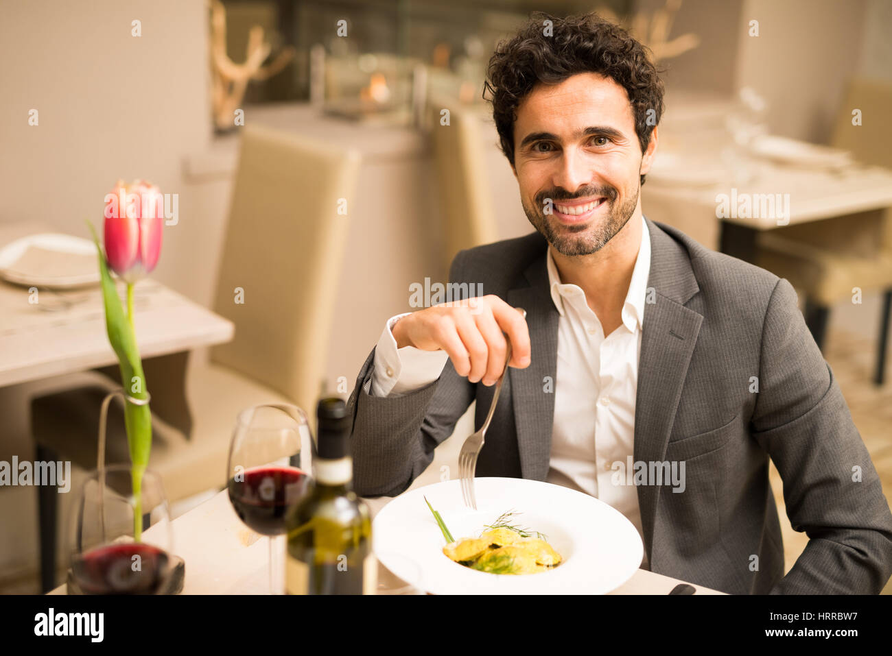 Man having lunch in a restaurant Stock Photo - Alamy