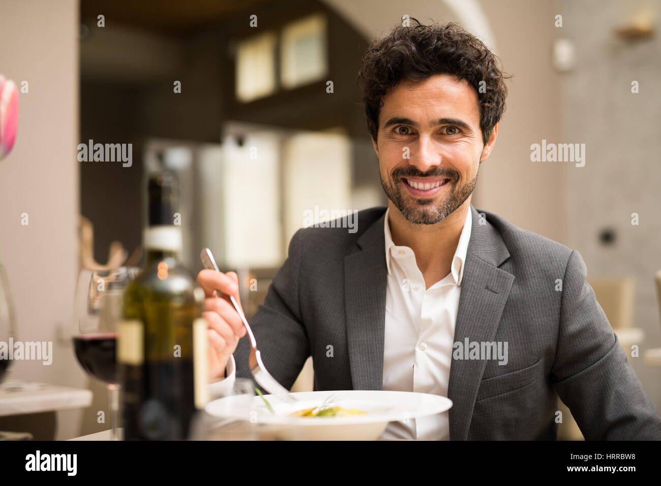 Man having lunch in a restaurant Stock Photo - Alamy