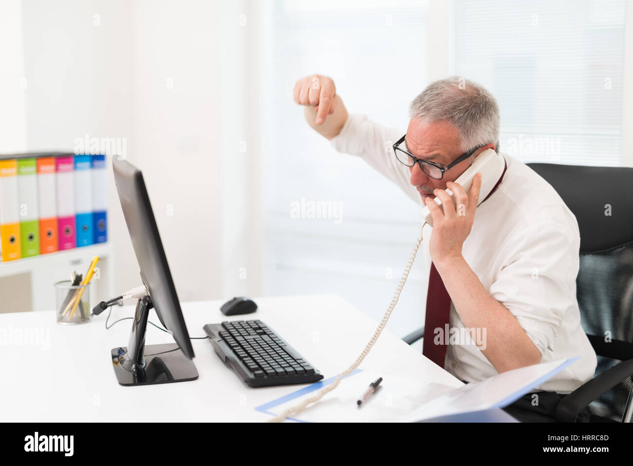 Portrait of an angry man yelling on the phone Stock Photo - Alamy