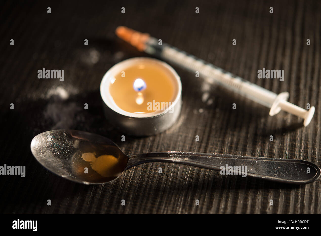 Drugs heroin syringe spoon candle hi-res stock photography and images ...