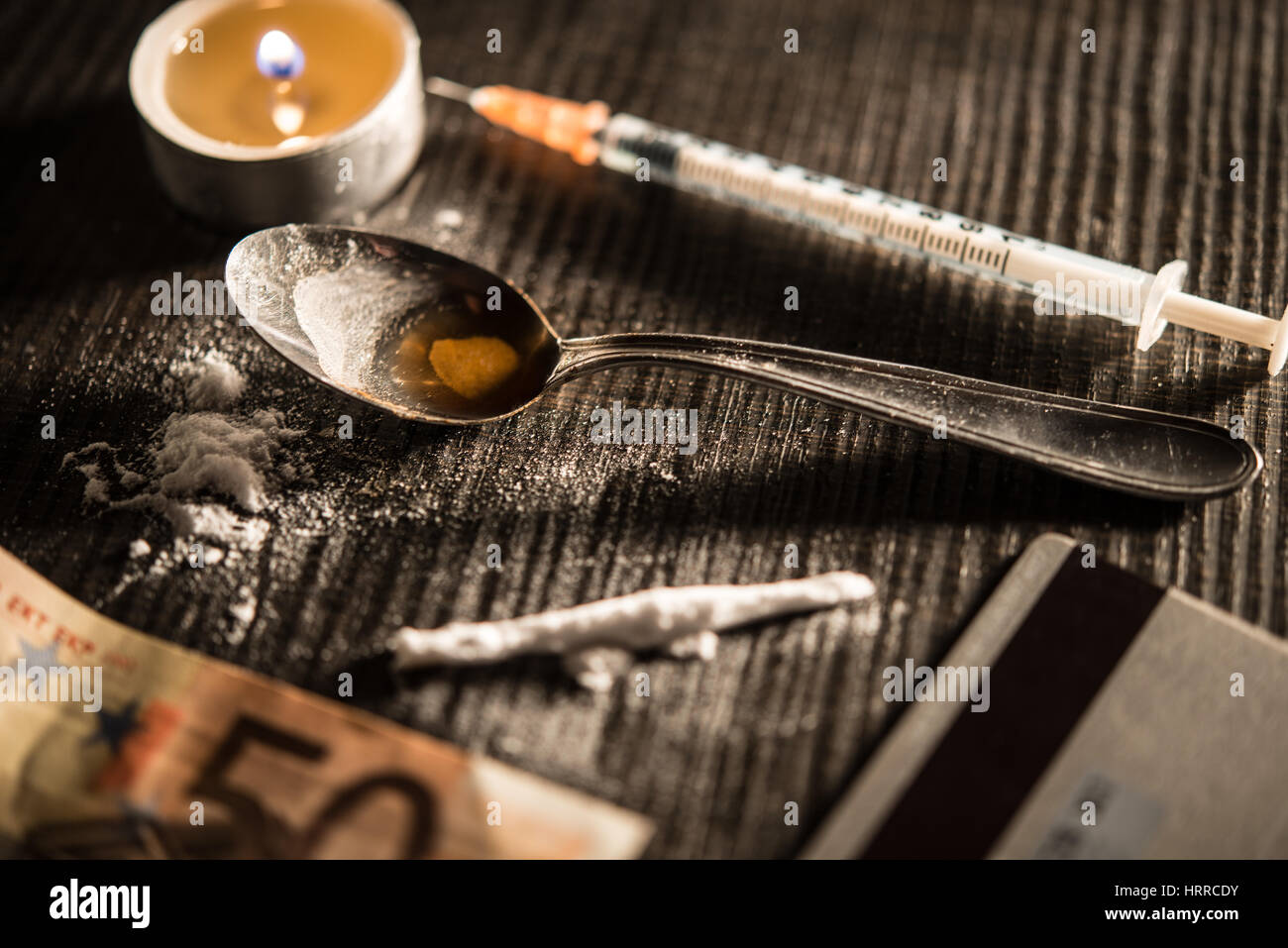 Drug, spoon and syringe on a table Stock Photo - Alamy