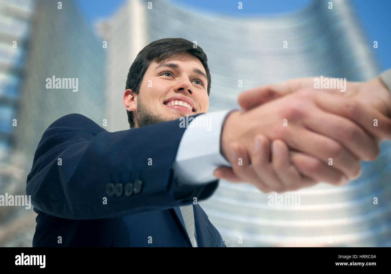 Business people shaking their hands Stock Photo - Alamy