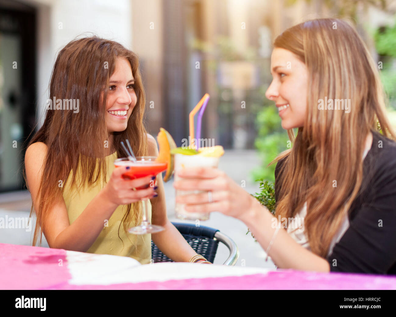 Friends having a drink together Stock Photo - Alamy