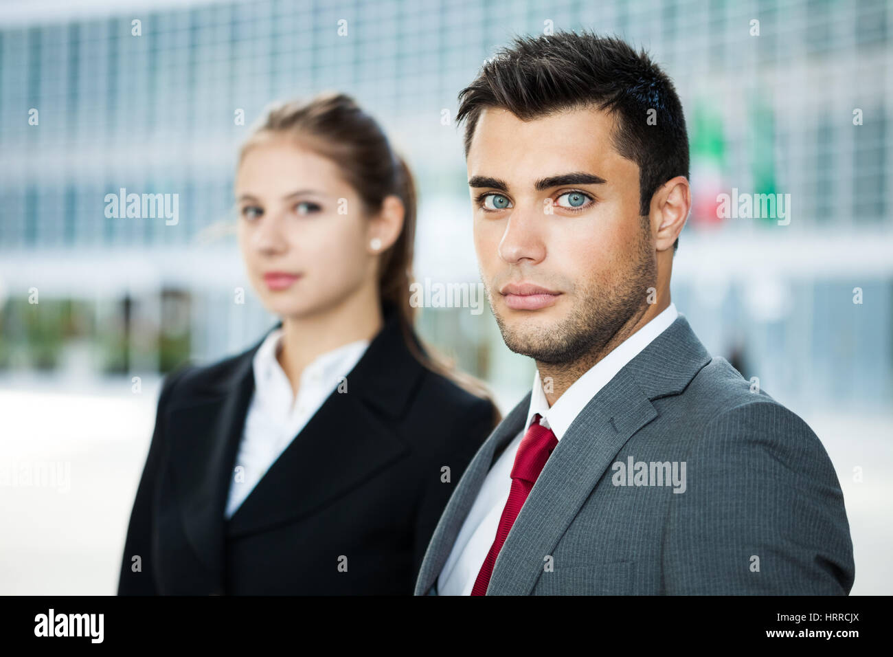 Two business people in front of their office Stock Photo - Alamy