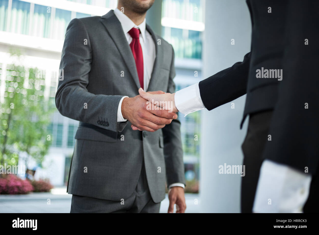 Handshake between business people Stock Photo - Alamy