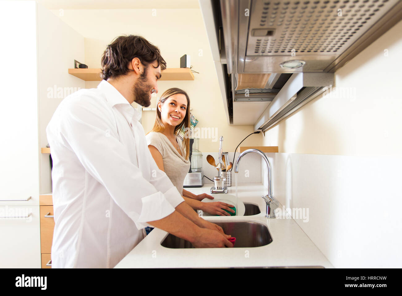 Family doing dishes hi-res stock photography and images - Alamy