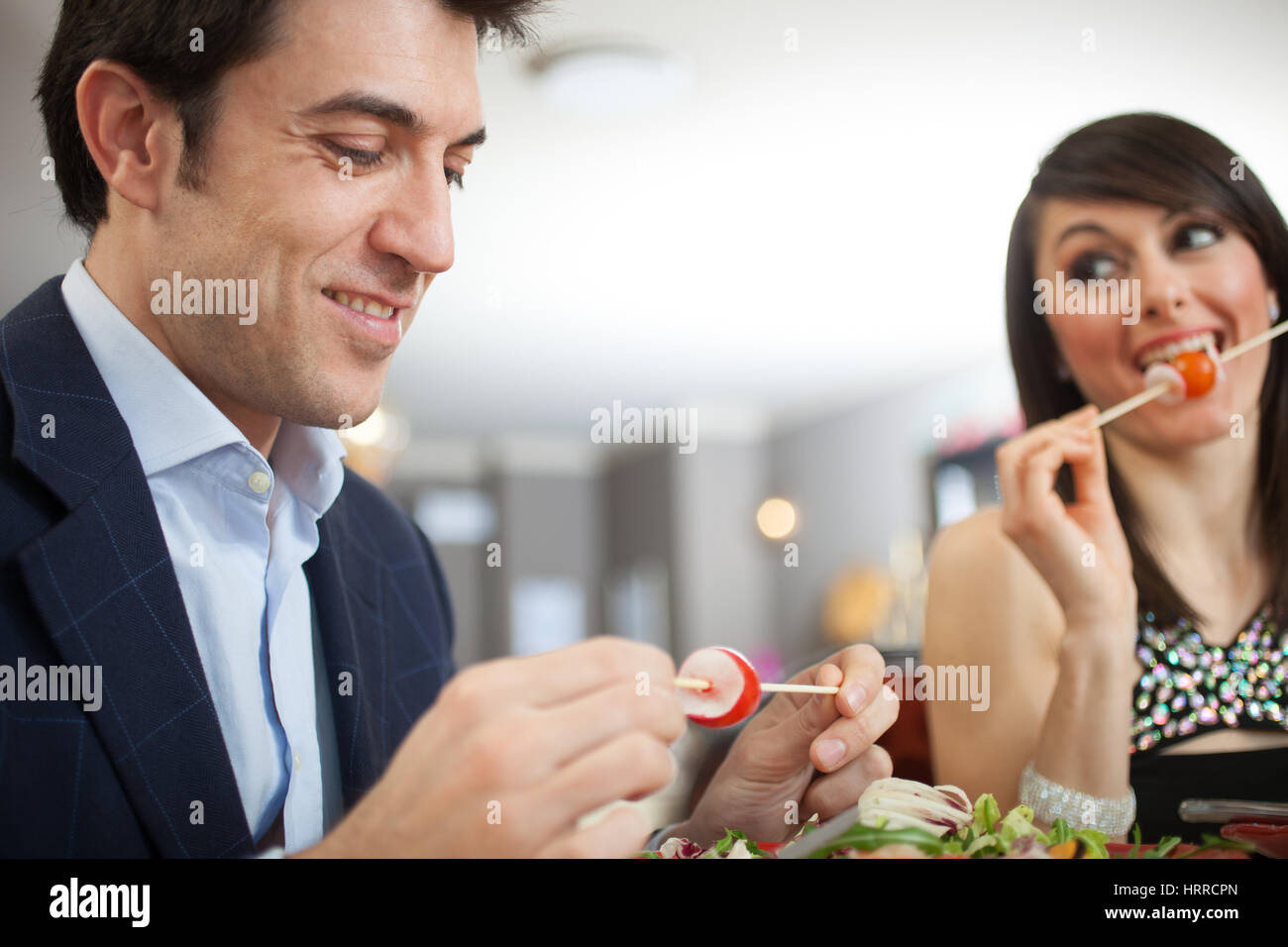 Couple eating in a restaurant Stock Photo - Alamy